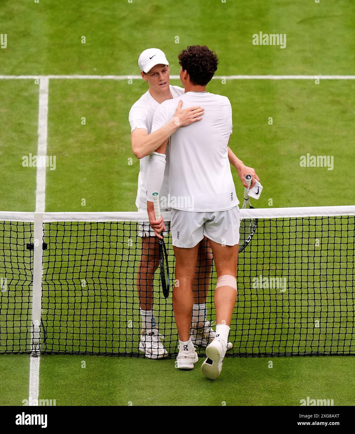 Jannik Sinner and Ben Shelton (right) after their match on day seven of the 2024 Wimbledon ...