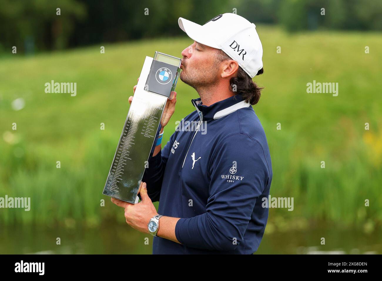 Scotland's Ewen Ferguson kisses the trophy after his winning the BMW ...