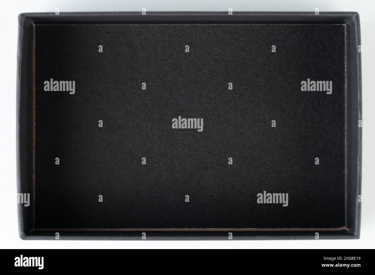 Black paper box above top view isolated on white studio background ...