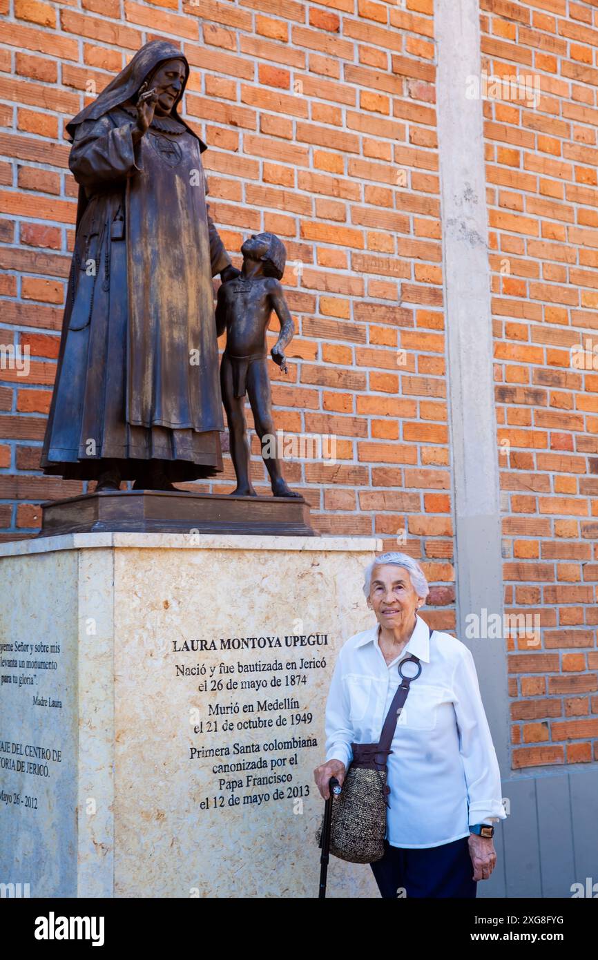 Jerico, Colombia - January 16, 2024: Senior woman next to the statue of ...