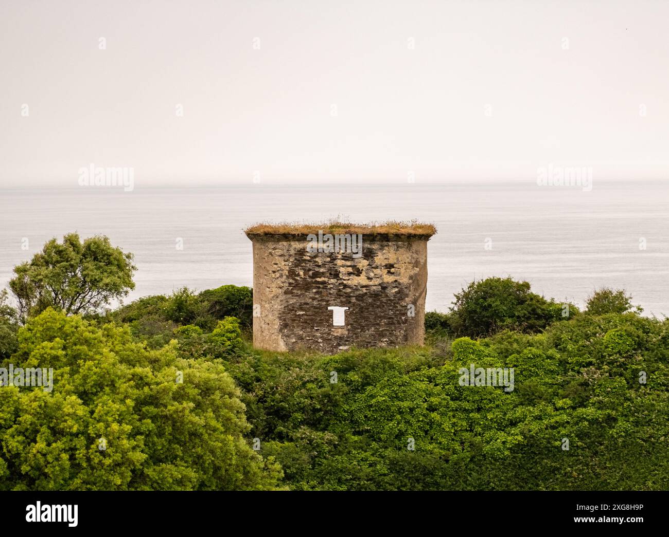 Watermouth, Devon, UK – June 24 2024. The round tower ruins on The ...