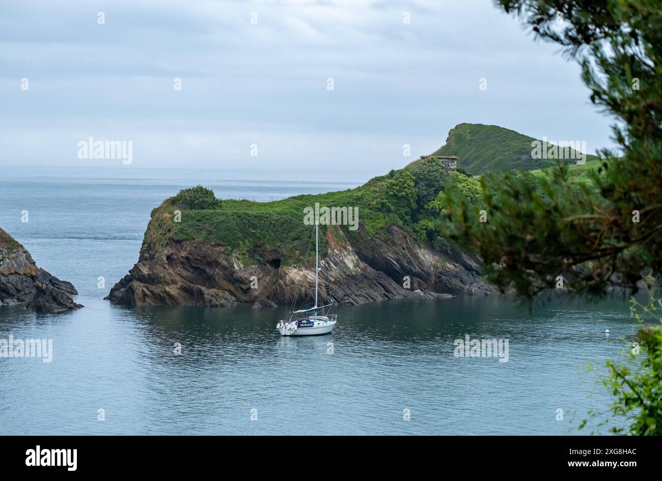 Watermouth, Devon, UK – June 24 2024. Small sailing boat moored in ...