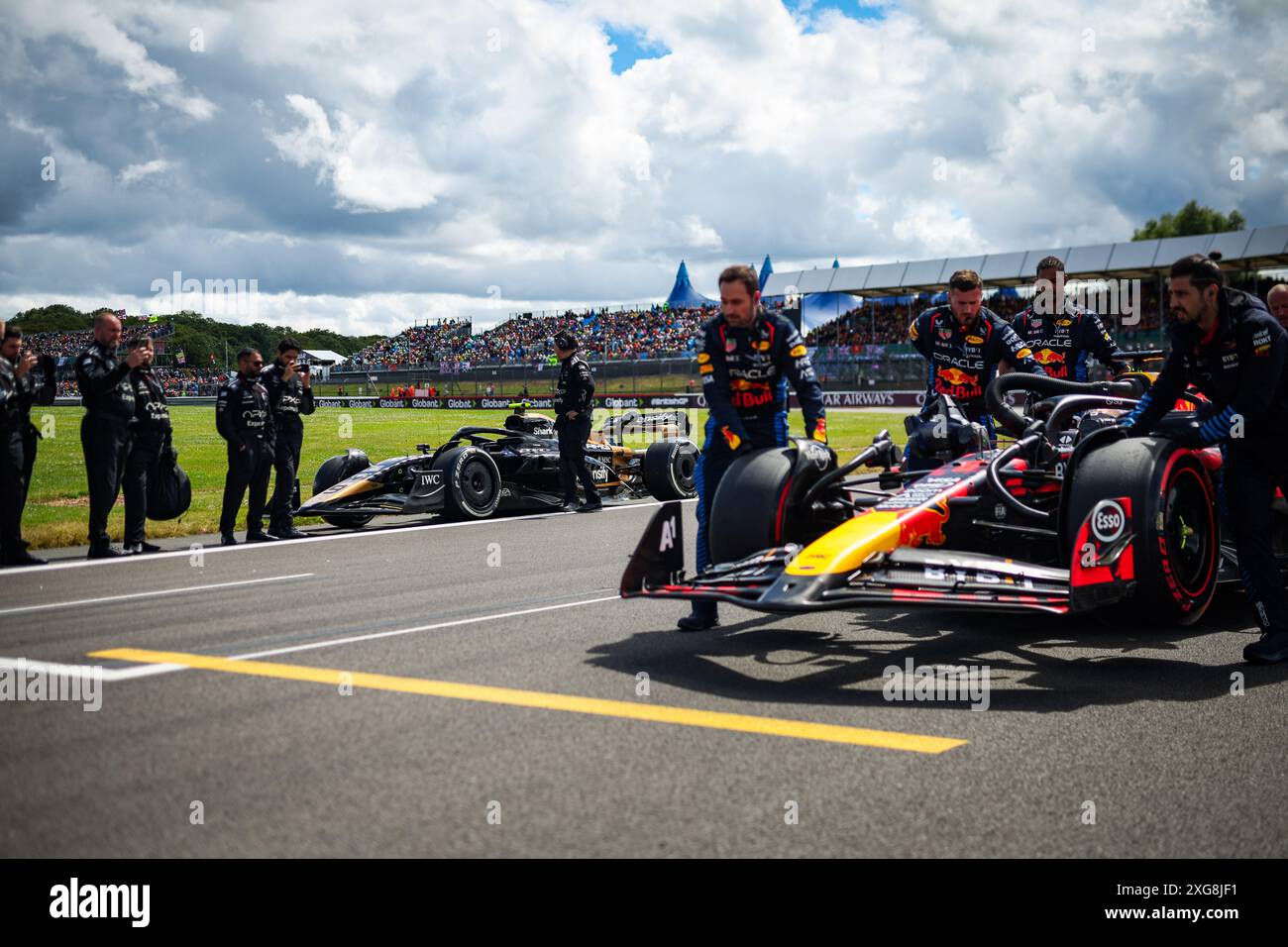 VERSTAPPEN Max (ned), Red Bull Racing RB20, and the Modified F2 car ...