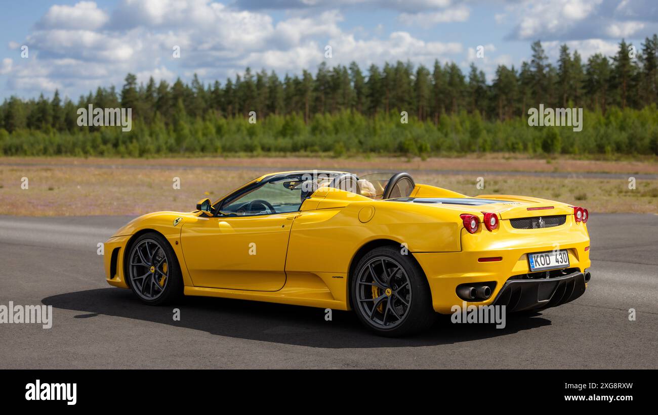 A yellow Ferrari f340 driving on a runway in Southern Finland Stock Photo - Alamy