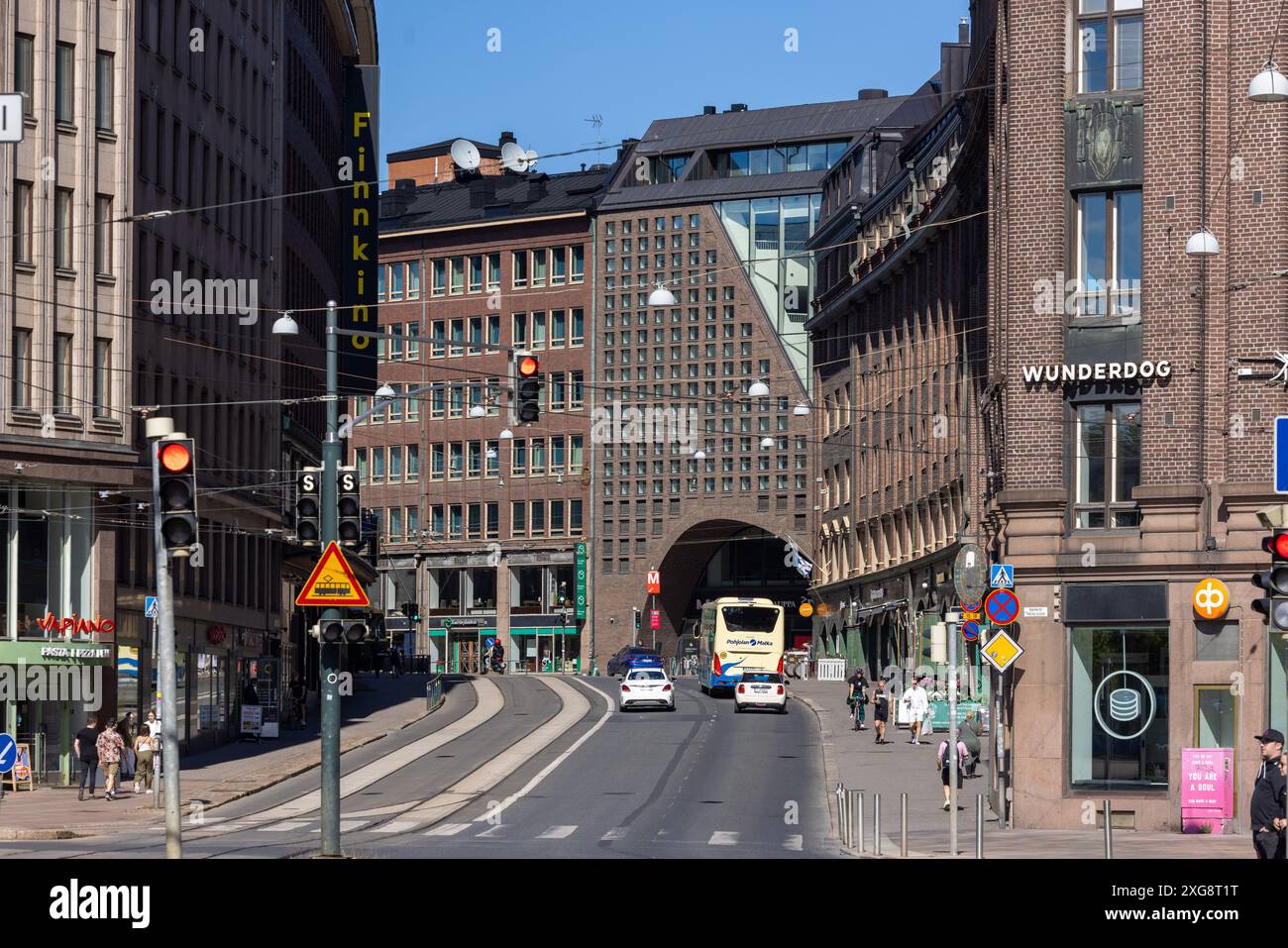 Tourists and historical buildings downtown Helsinki on a summer day ...
