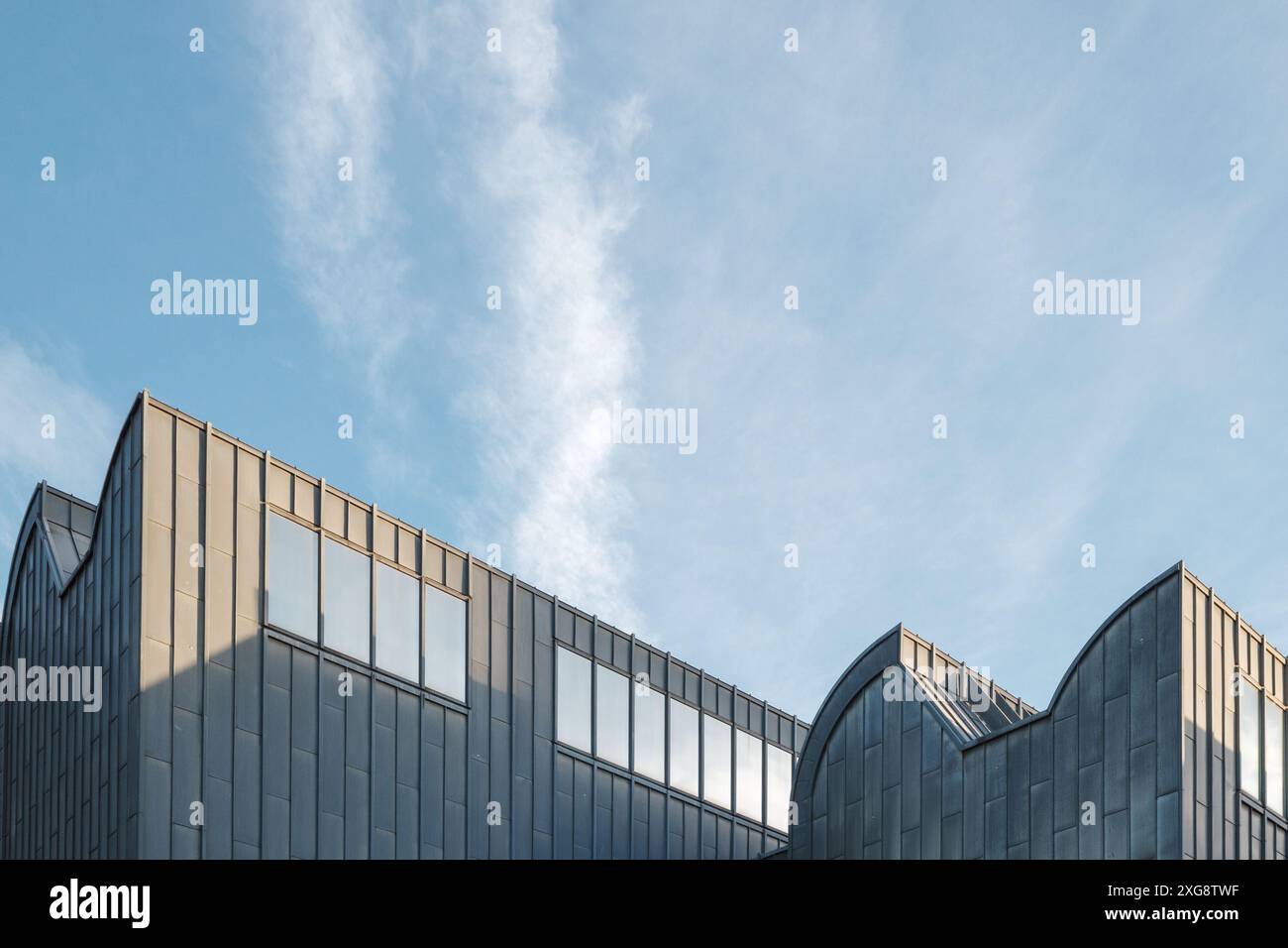 A striking modern architectural building with a sleek design, featuring ...