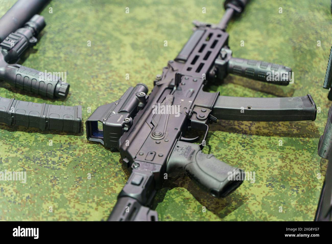 Modern weapons automatic rifles and machine gun on the counter ...
