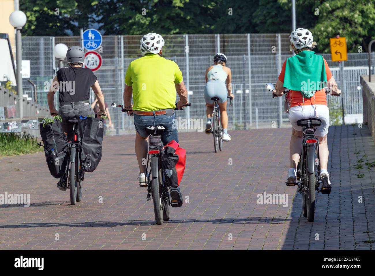 Female cyclist from behind with helmet hi-res stock photography and ...