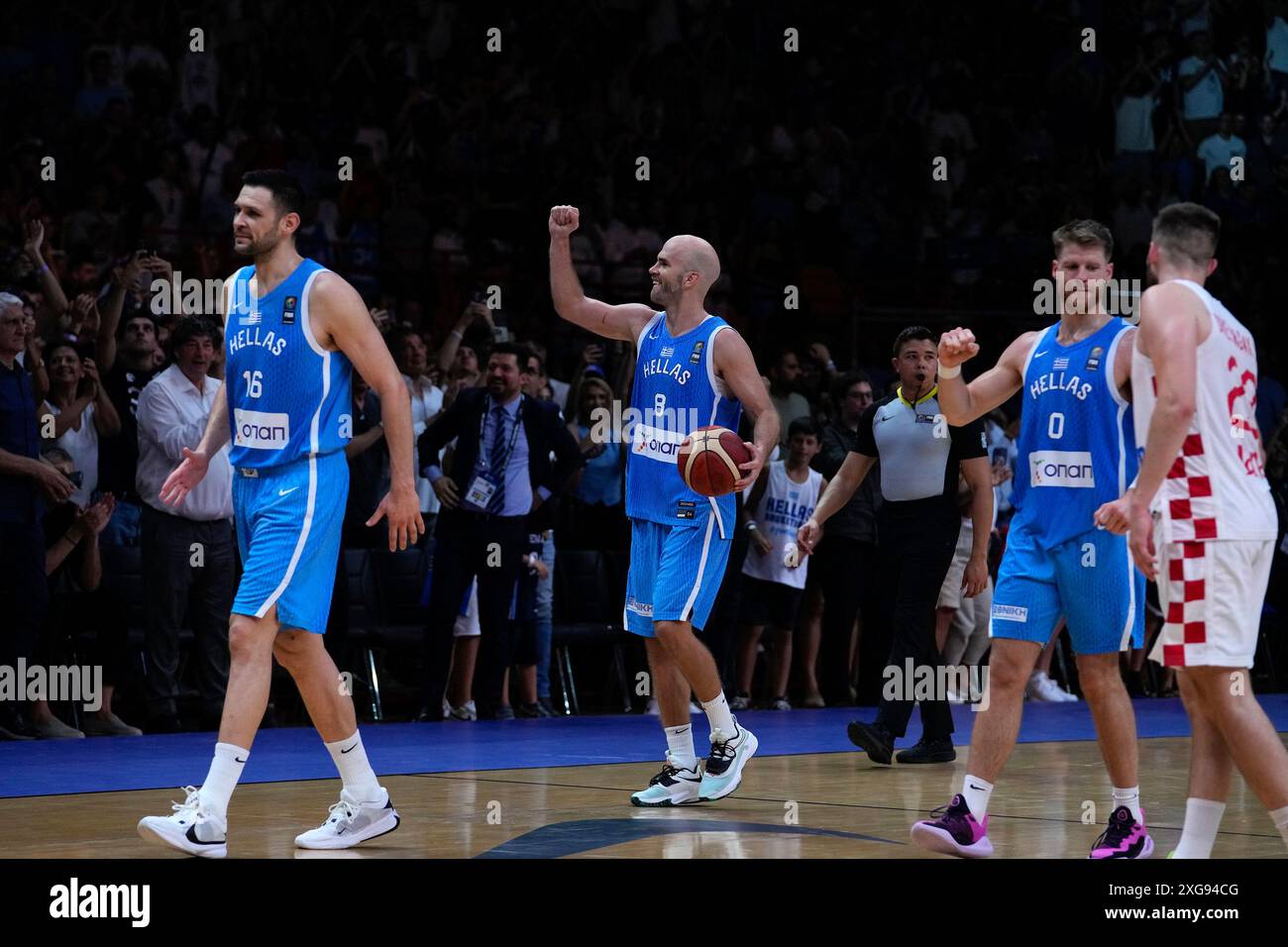 Greece's Nick Calathes, center, celebrates after his team qualified for ...