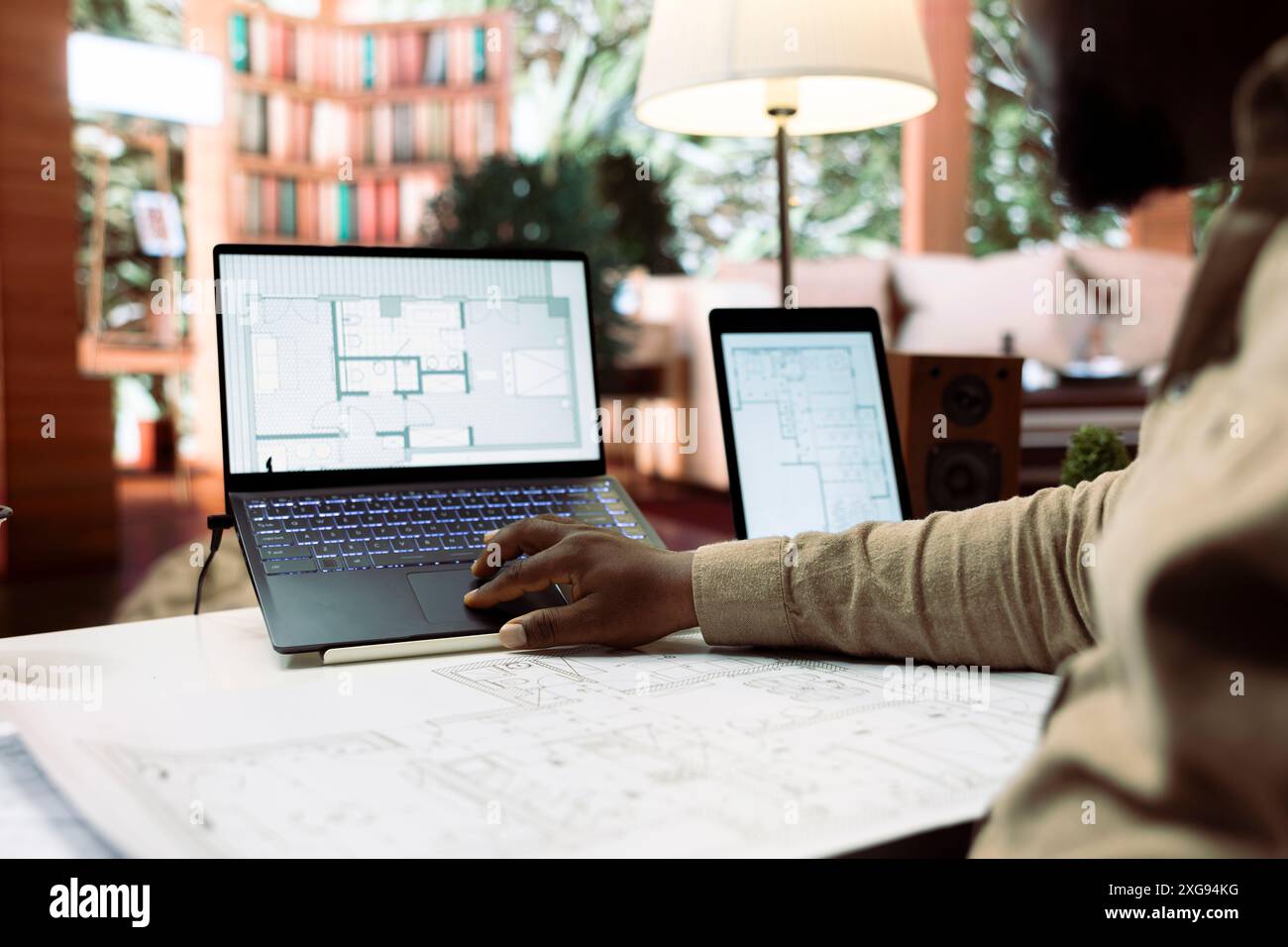 Businessman using digital tools to draft and plan office spaces to ...