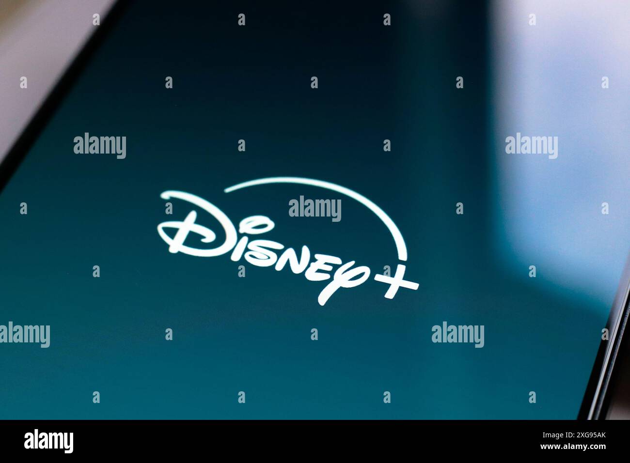 In this photo illustration, the Disney Plus streaming app logo is ...