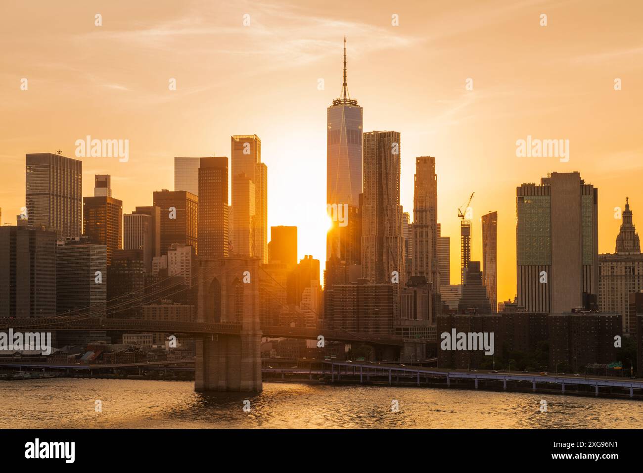 Brooklyn Bridge and New York City skyline across the East River ...