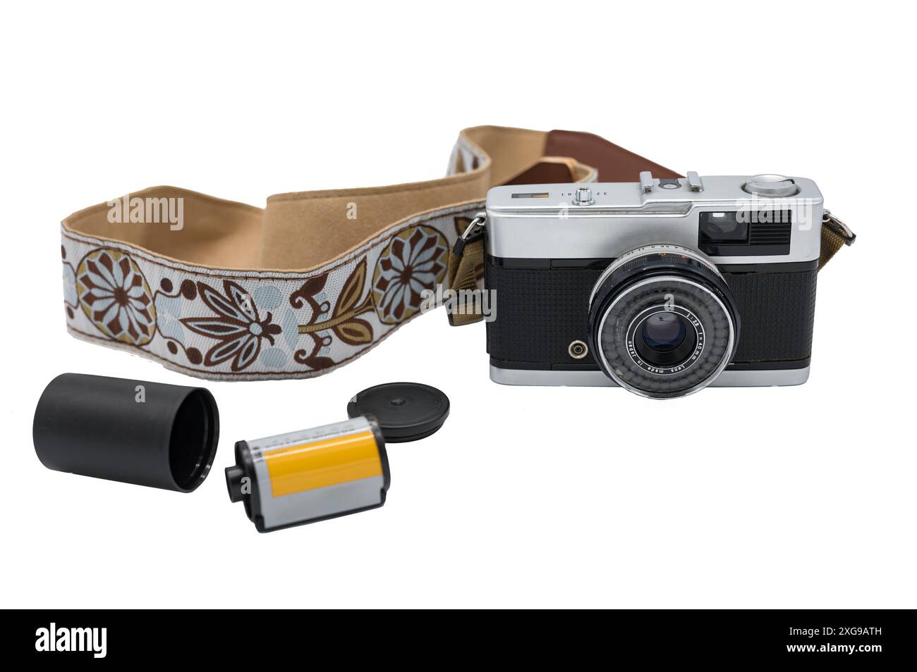 Detail of an old compact camera with a nice strap and a 35mm film reel ...