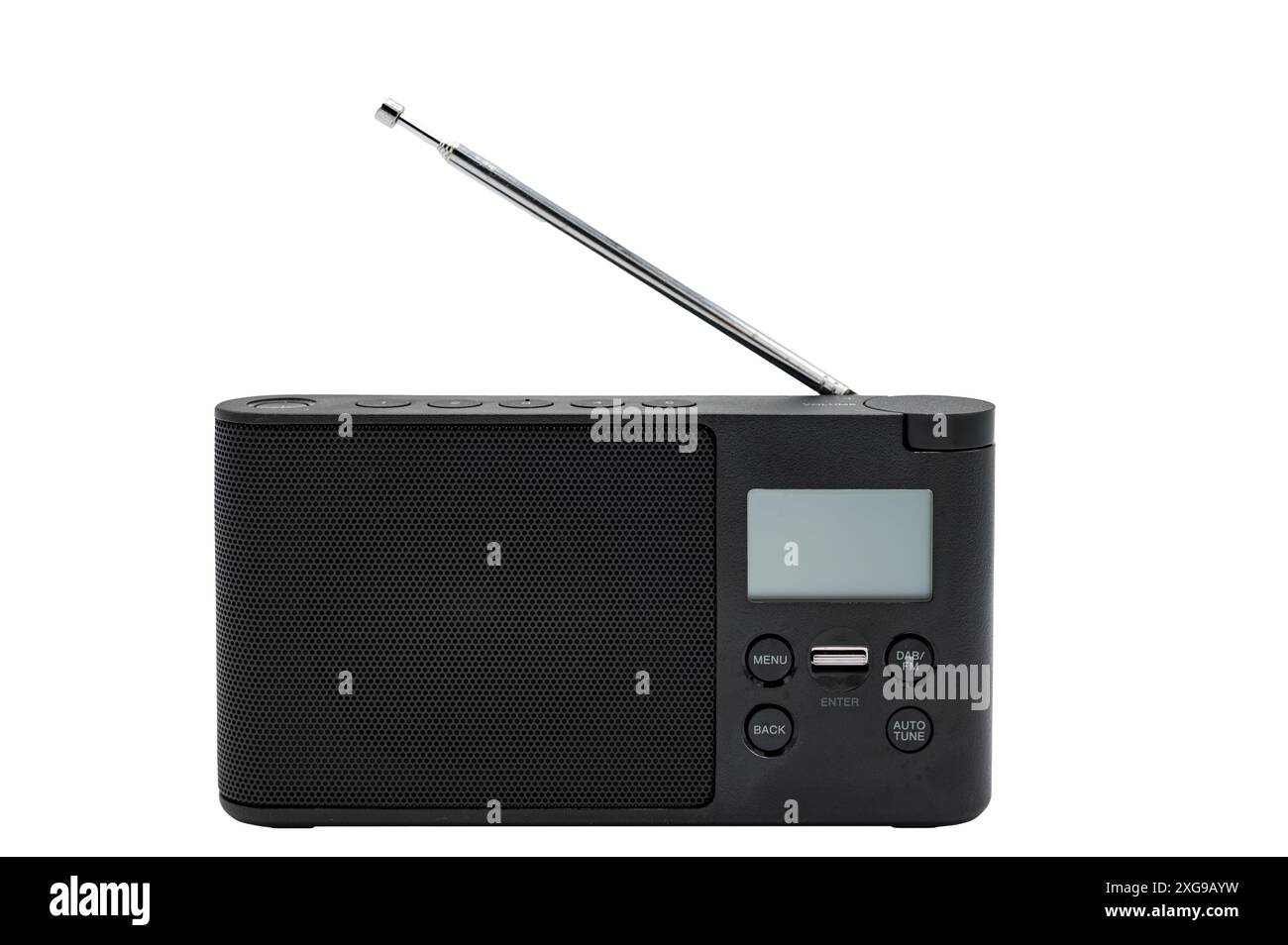 Detail of a small black battery-powered portable radio on a white ...