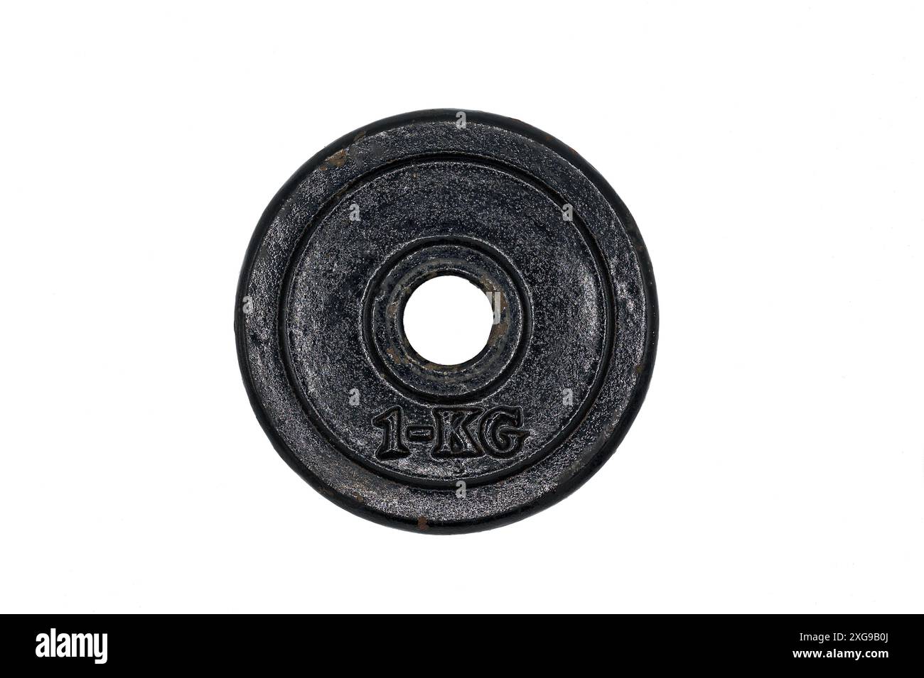 Detail of an old 1kg metal dumbbell disc on a white background Stock ...