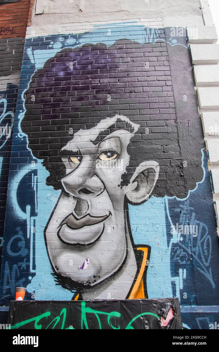 Black cartoon character mural in an alley near Saint-Laurent Boulevard ...