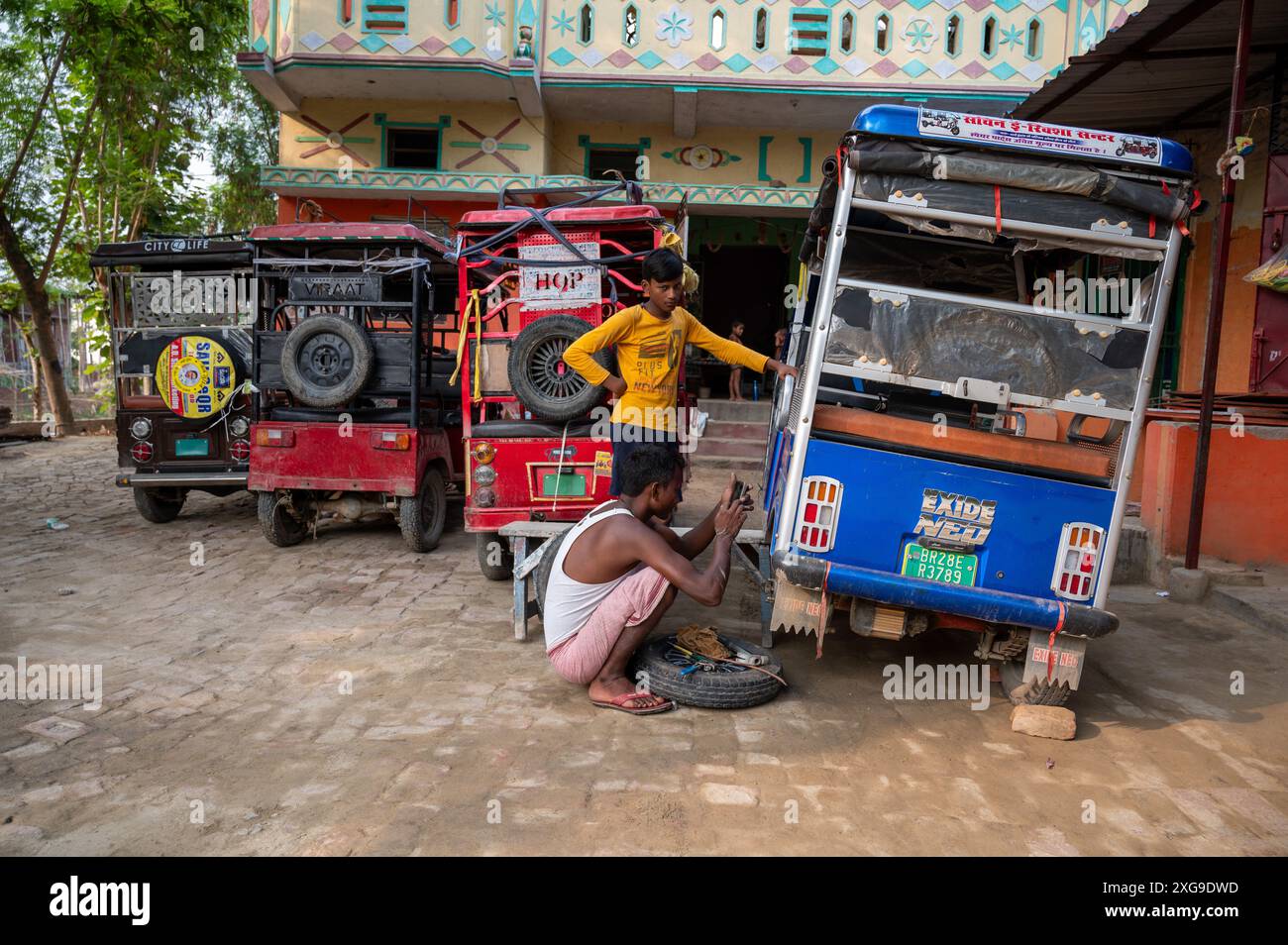 Gopalganj, Bihar, India. 27th June, 2024. An electric Rickshaw owner ...