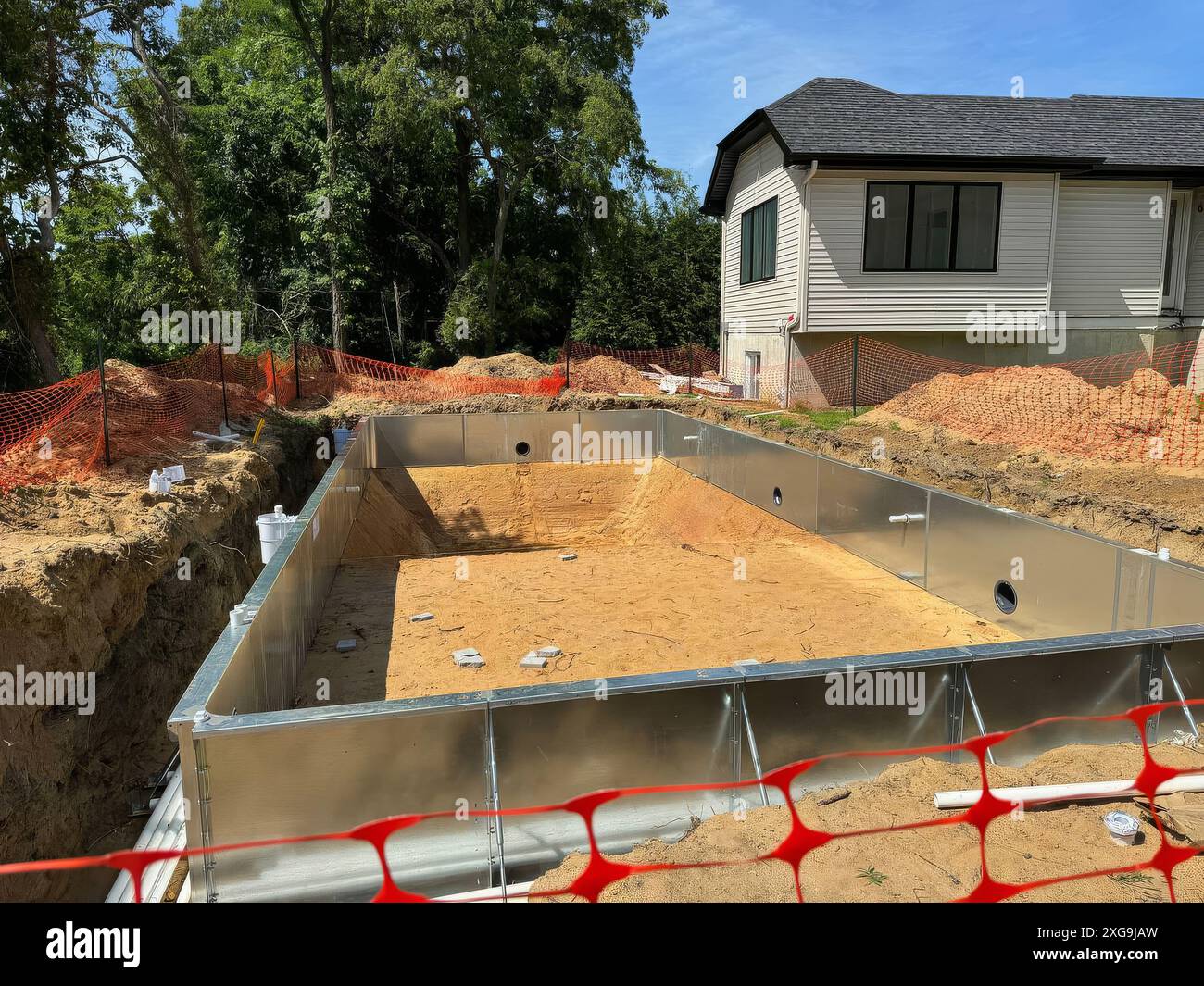 Steel structure is being constructed for swimming pool near house Stock ...