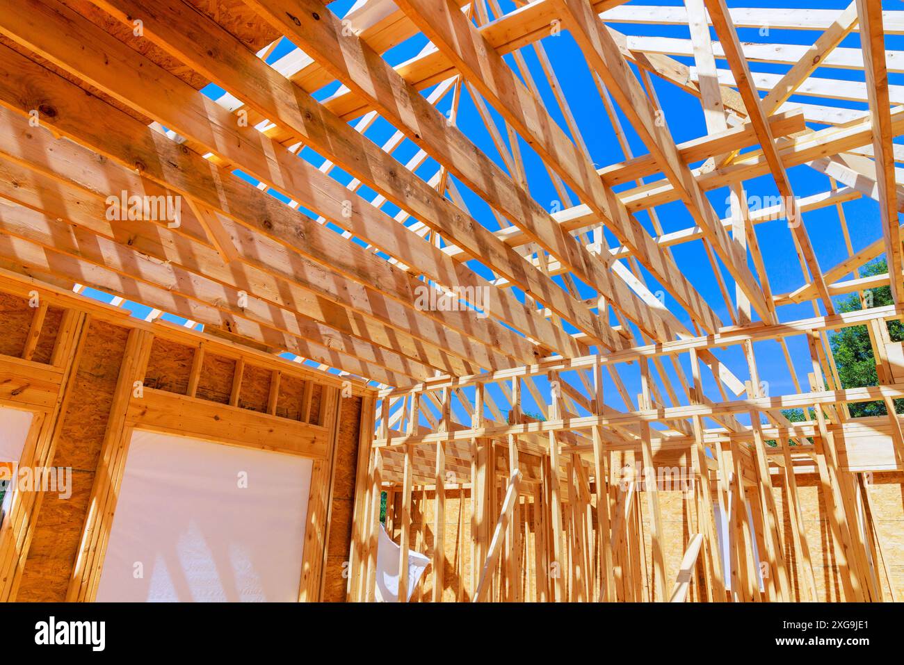 New home that is under construction with timber truss frame has roof ...