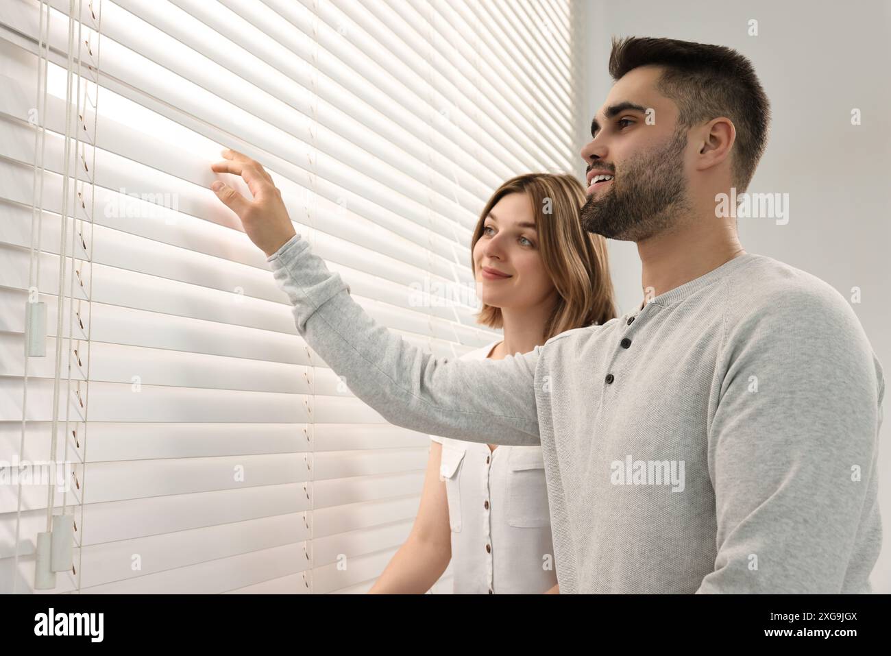 Couple near windows hi-res stock photography and images - Alamy
