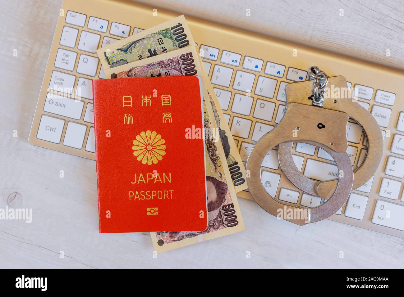 Law enforcement handcuffs on Japanese yen banknotes, Japan passport ...