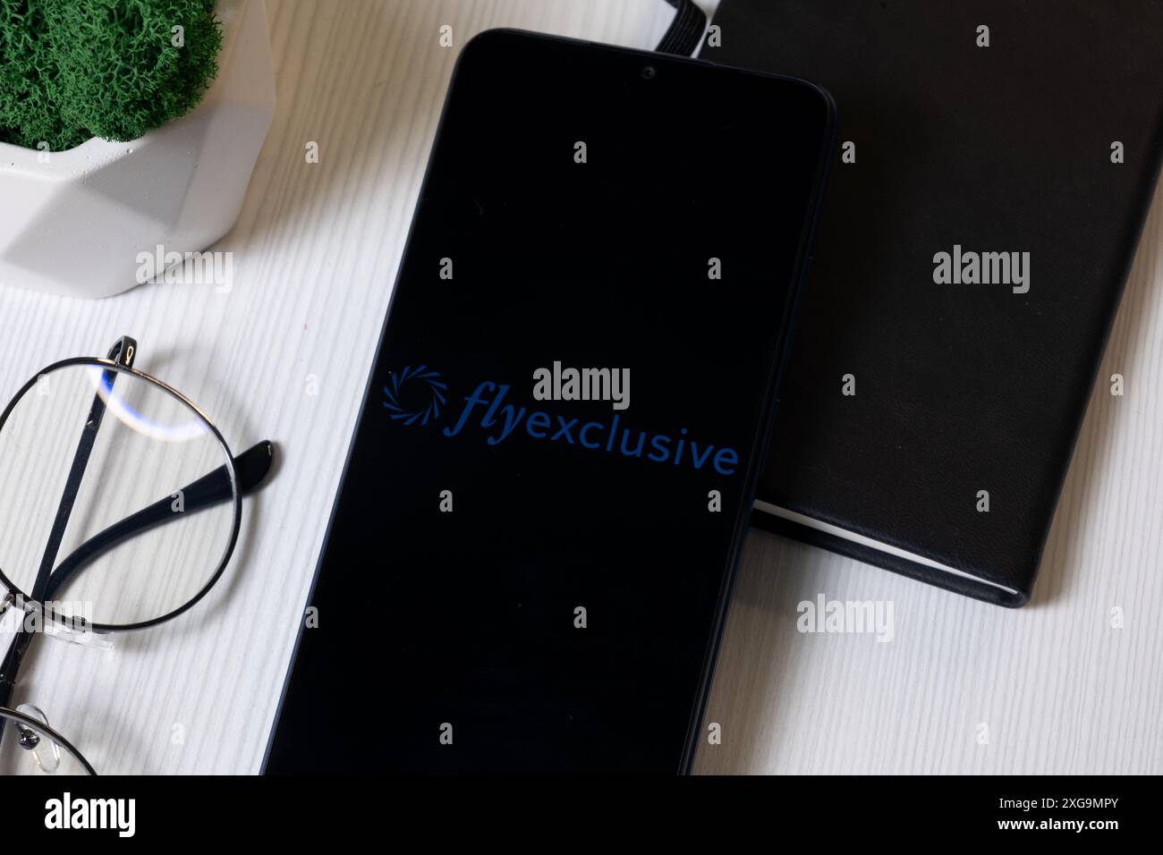 New York, USA - 1 June 2024: flyExclusive Logo on Phone Screen, Company ...