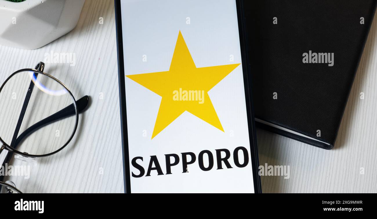 New York, USA - 1 June 2024: Sapporo Holdings Logo on Phone Screen, Company Icon Stock Photo - Alamy