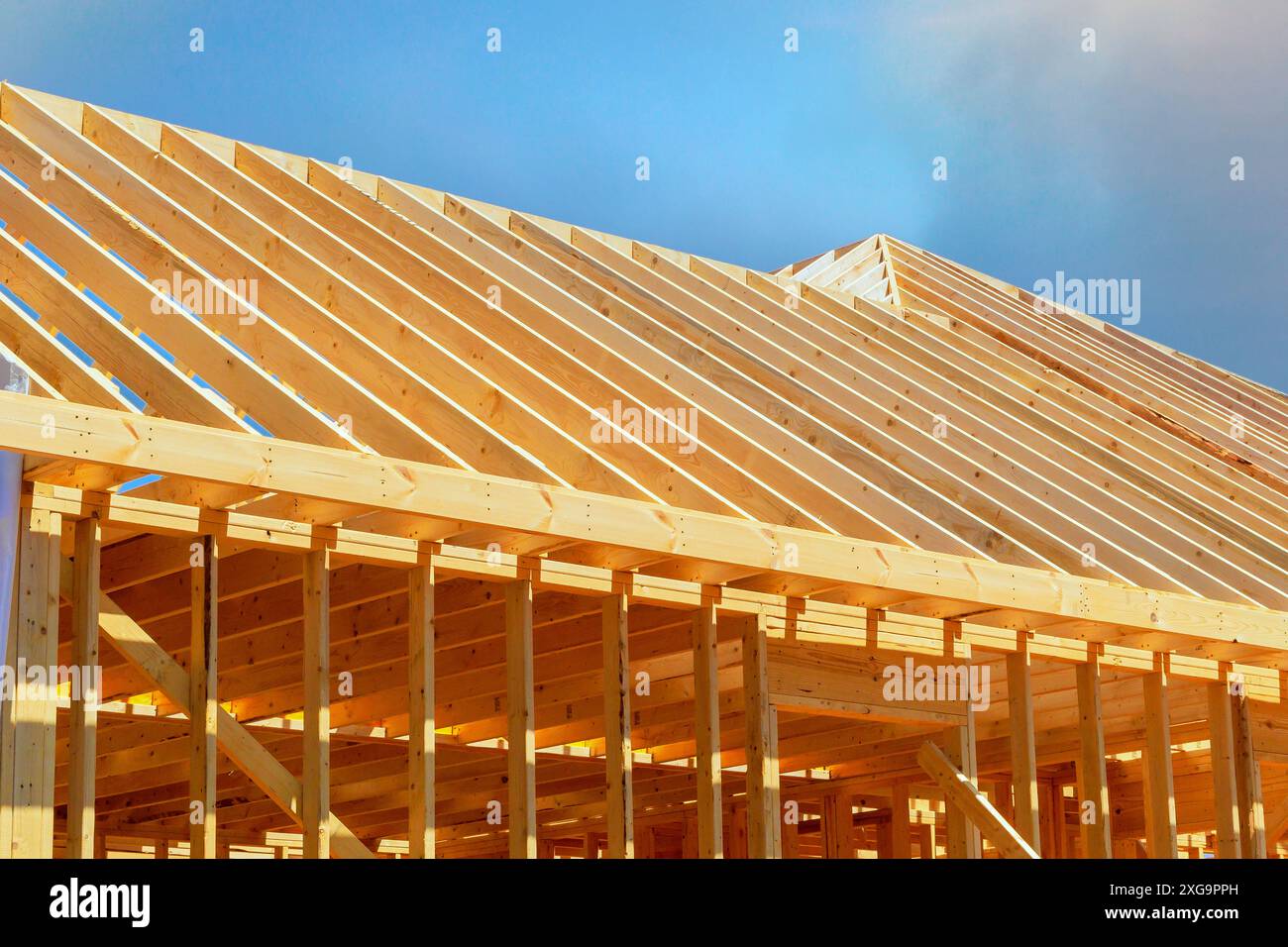 Currently under construction, new frame building with rafters, roof ...