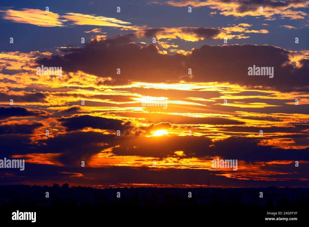 Sunset backdrop with awesome clouds. Evening horizon featuring stunning ...