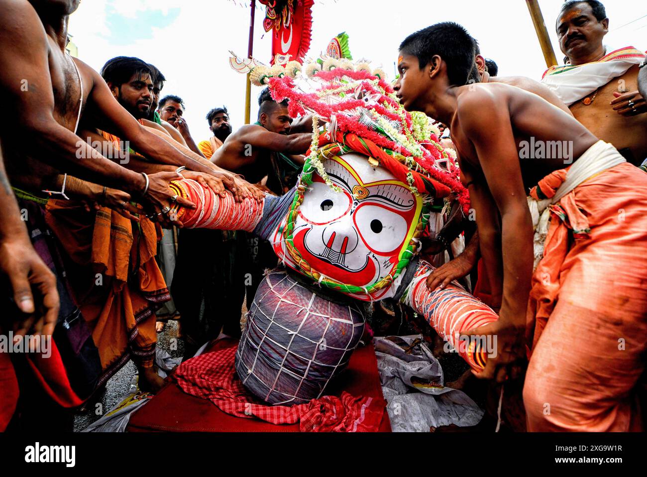 A group of priests offers prayers to Lord Balabhadra during the annual ...