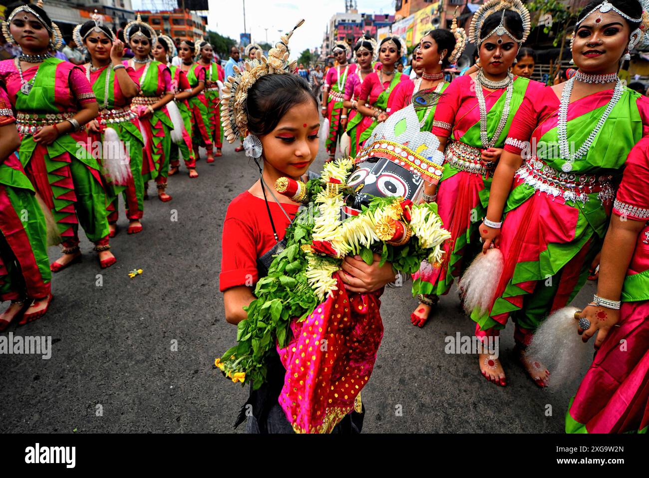 A little Bharatanatyam (Indian classical dance) dancer with an idol of ...