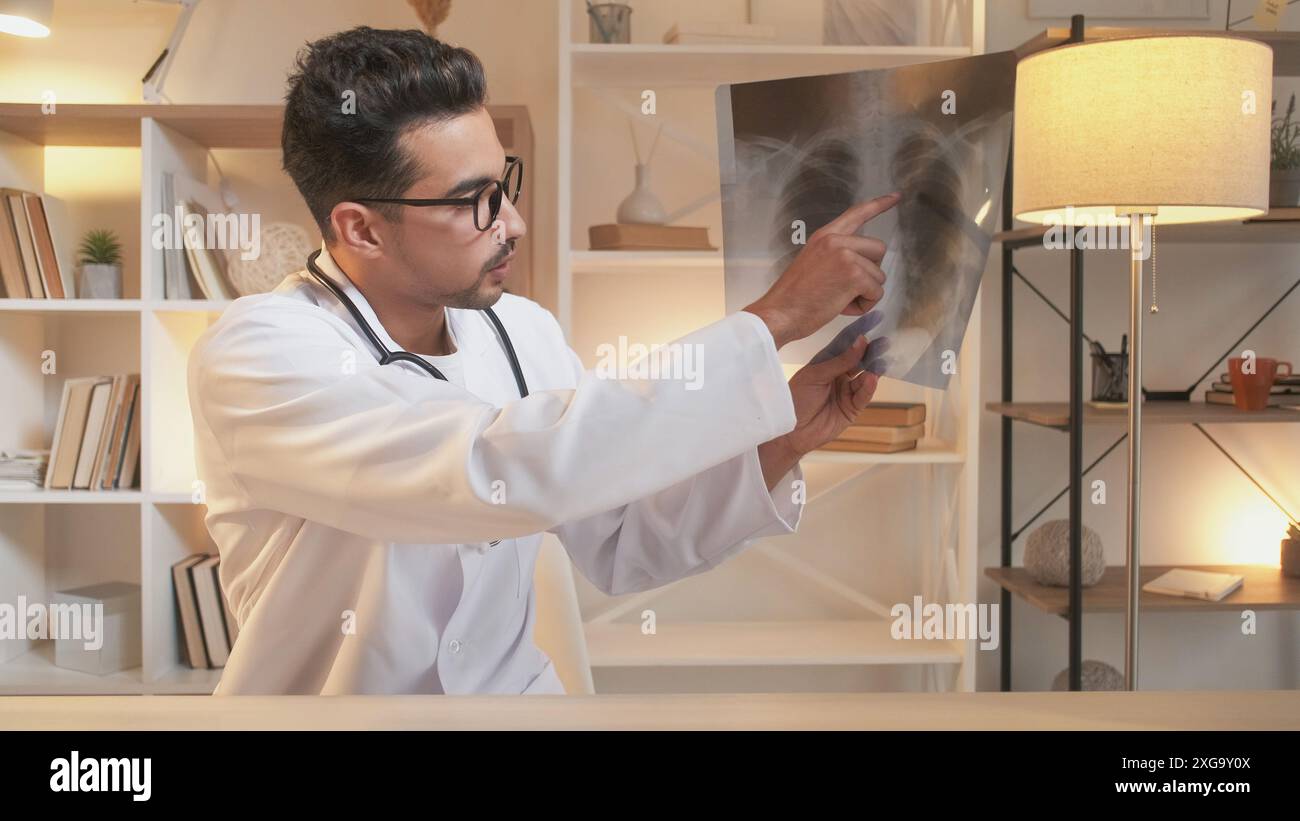 Diagnosis consultation. Online doctor. Smart medical specialist man explaining x ray of lungs ...