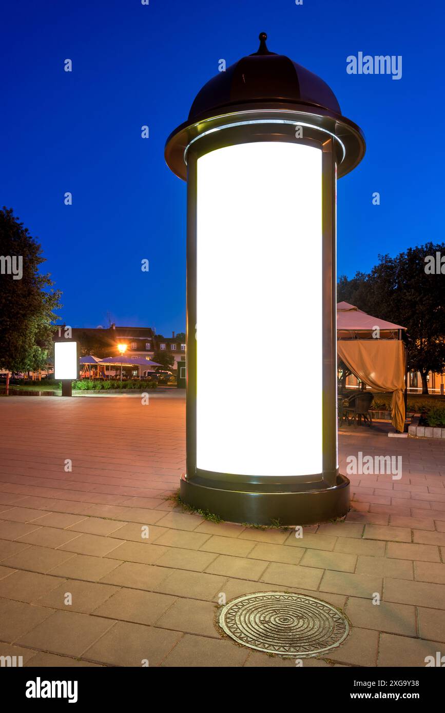 Blank Mockup Of Round Billboard In A City Square At Night. Classic ...