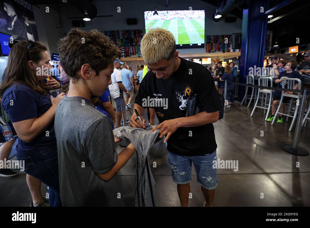 July 7, 2024: Sporting Kansas City midfielder Memo Rodriguez (8) signs ...