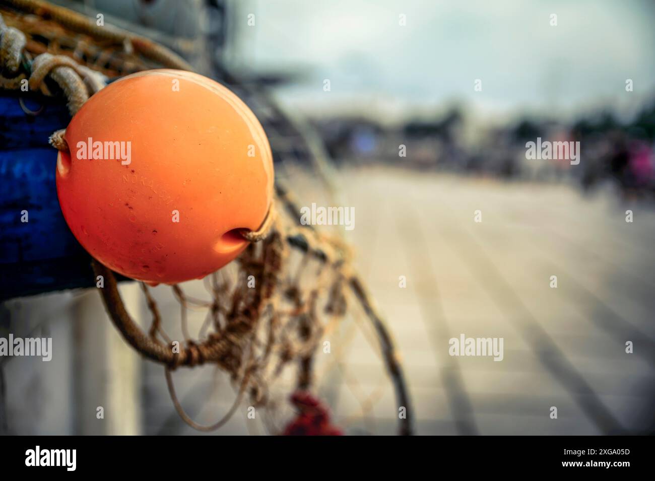 Orange netball in front of a blurred background Stock Photo - Alamy