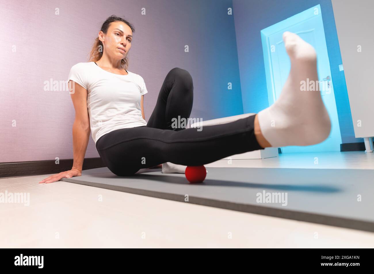 Athletic Caucasian Slim Woman Doing Myofascial Self Massage Of The