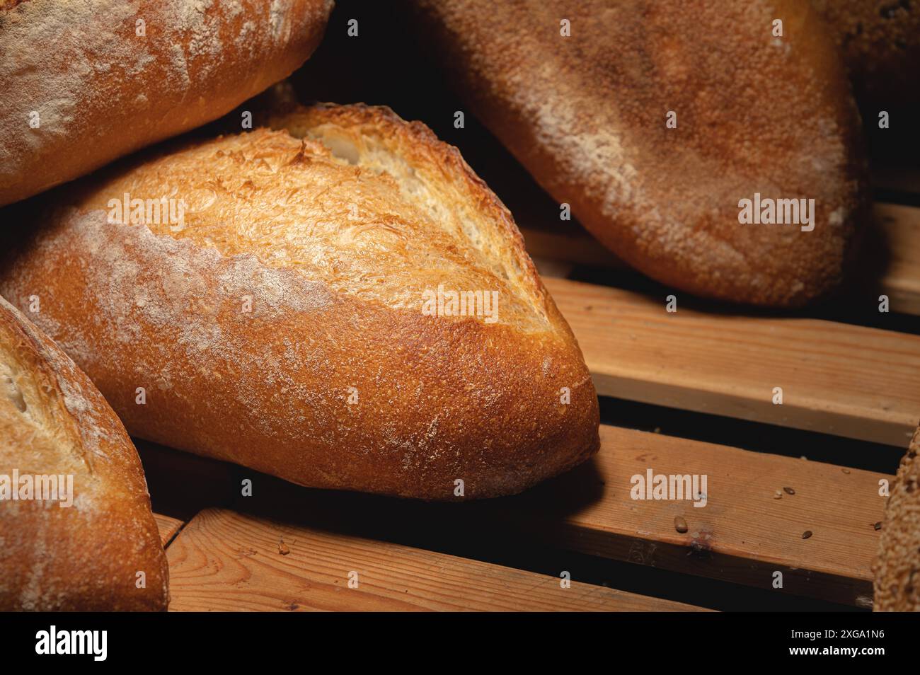 Craft loaves of bread. Fresh hot bread from the oven. Appetizing and ...
