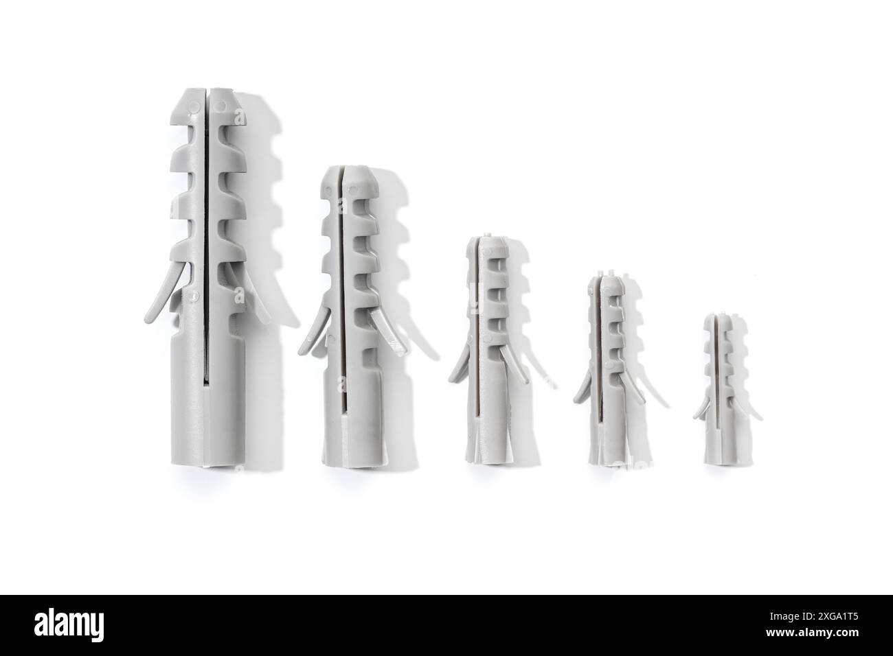 Group of Plastic dowels isolated on a white background. Wall plugs in ...