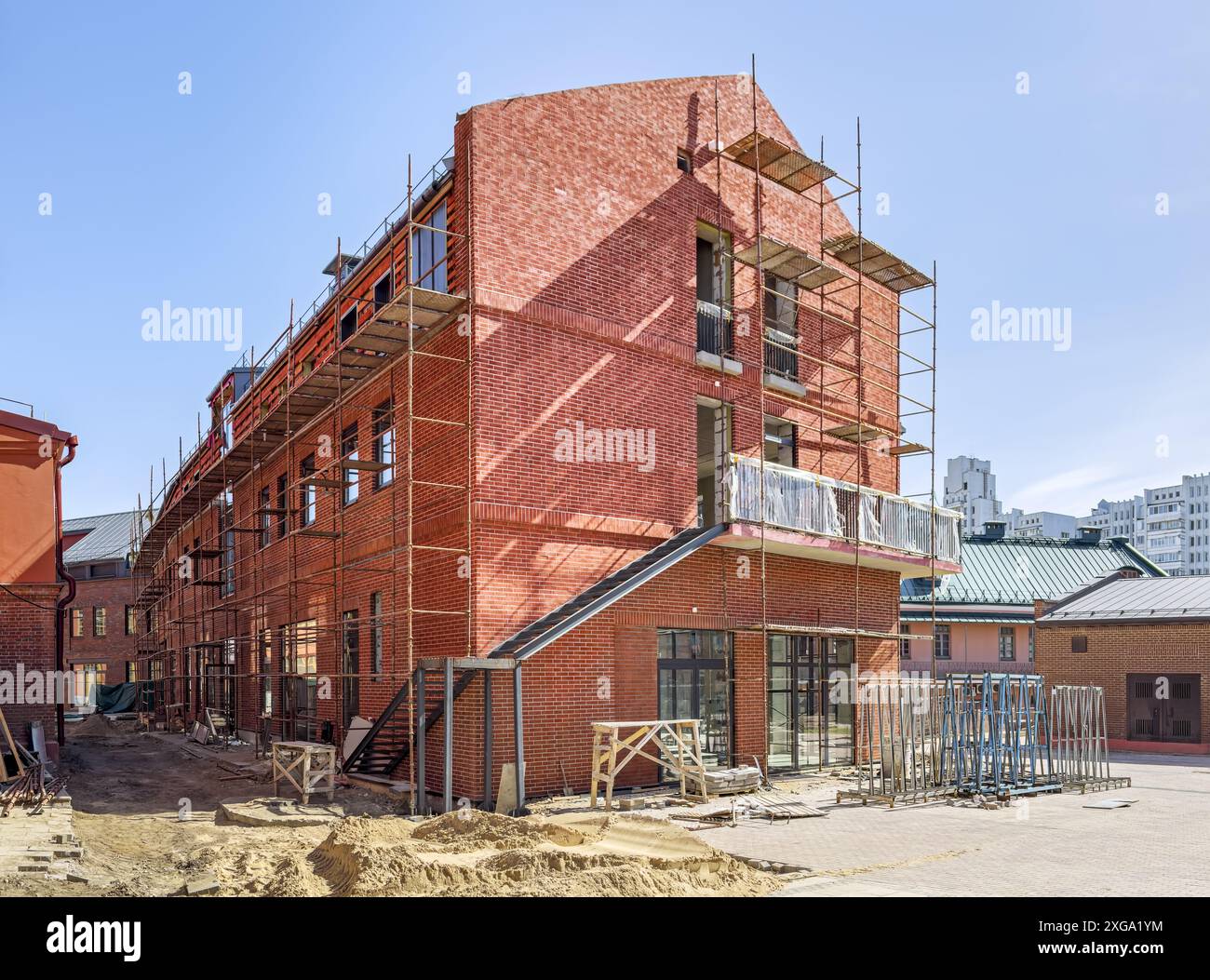 renovation of old house. scaffolding around the building under ...
