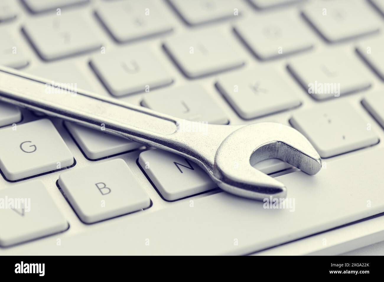 Wrench on computer keyboard. Computer fixing, service or maintenance ...