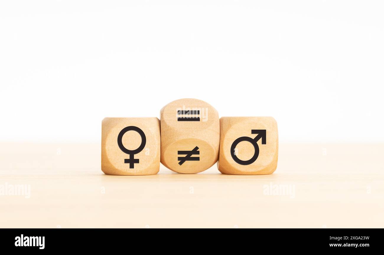 Gender equality concept. Wooden block turning a unequal sign to a equal ...