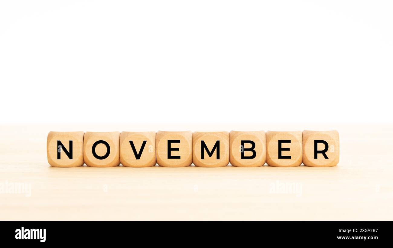November word on wooden blocks. Copy space. White background Stock ...