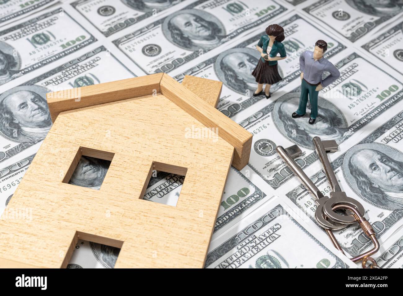 Investing in a house concept. Real estate prices. Toy house and ...