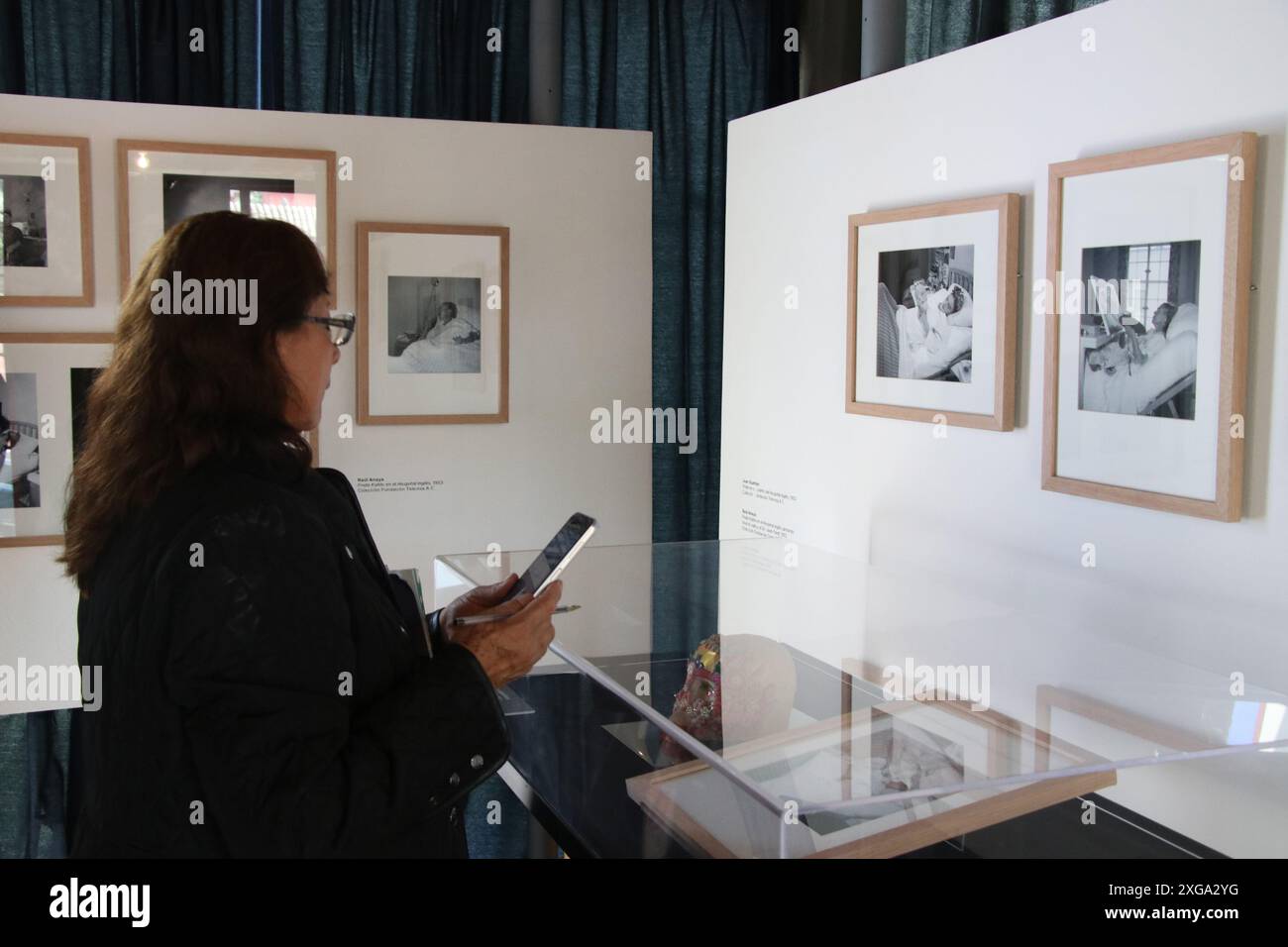 Non Exclusive: A woman taking a photo during a media tour for “Kahlo ...