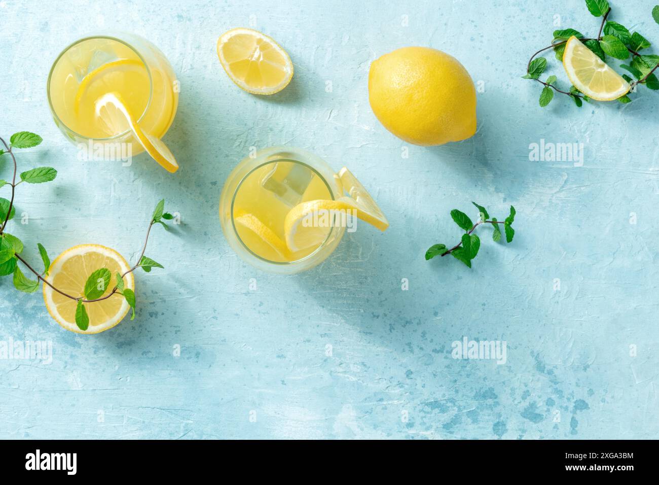 Lemonade on a blue background with copy space. Homemade fresh drink ...