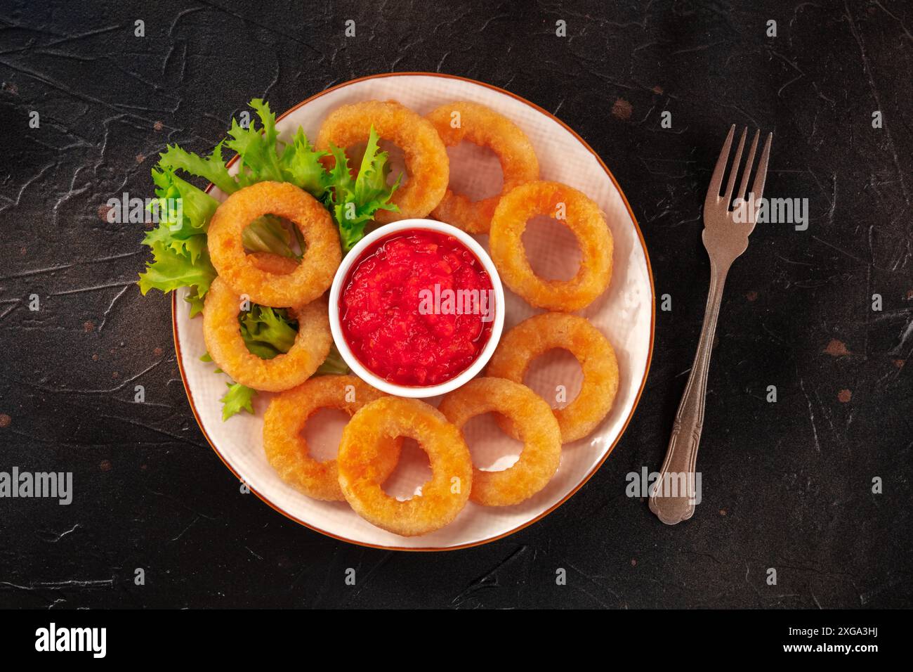 Calamari rings. Deep fried squid rings with lettuce leaves and tomato ...