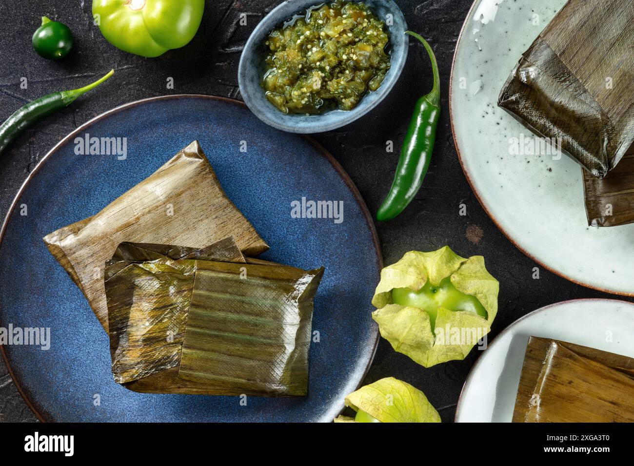 Tamale, traditional food of the cuisine of Mexico, wrapped in green ...