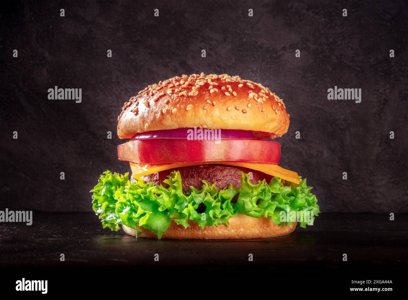 Burger on a black background. Beef patty steak with a lettuce leaf ...