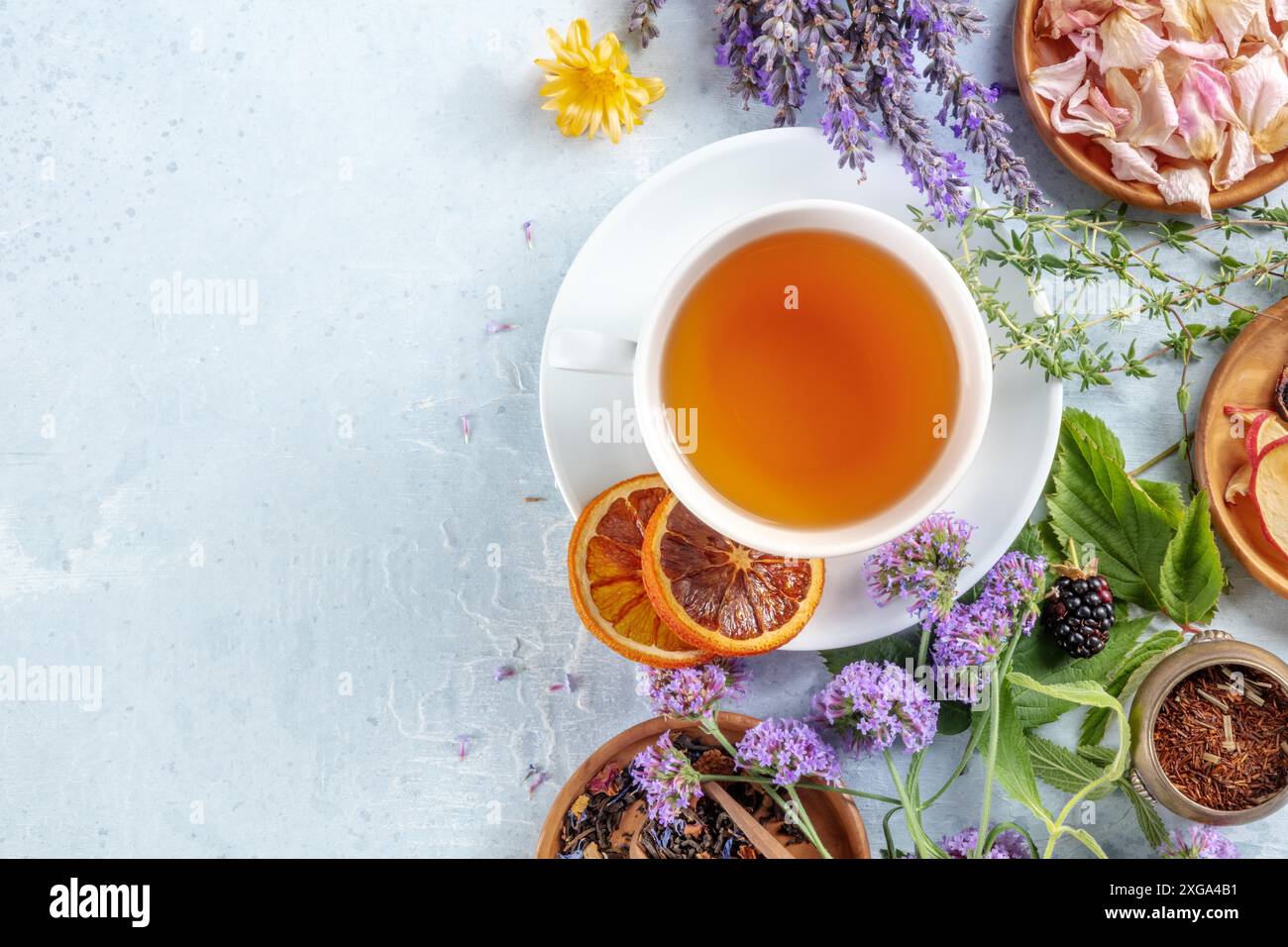 Tea banner with herbs, flowers and fruit, top shot with copy space ...