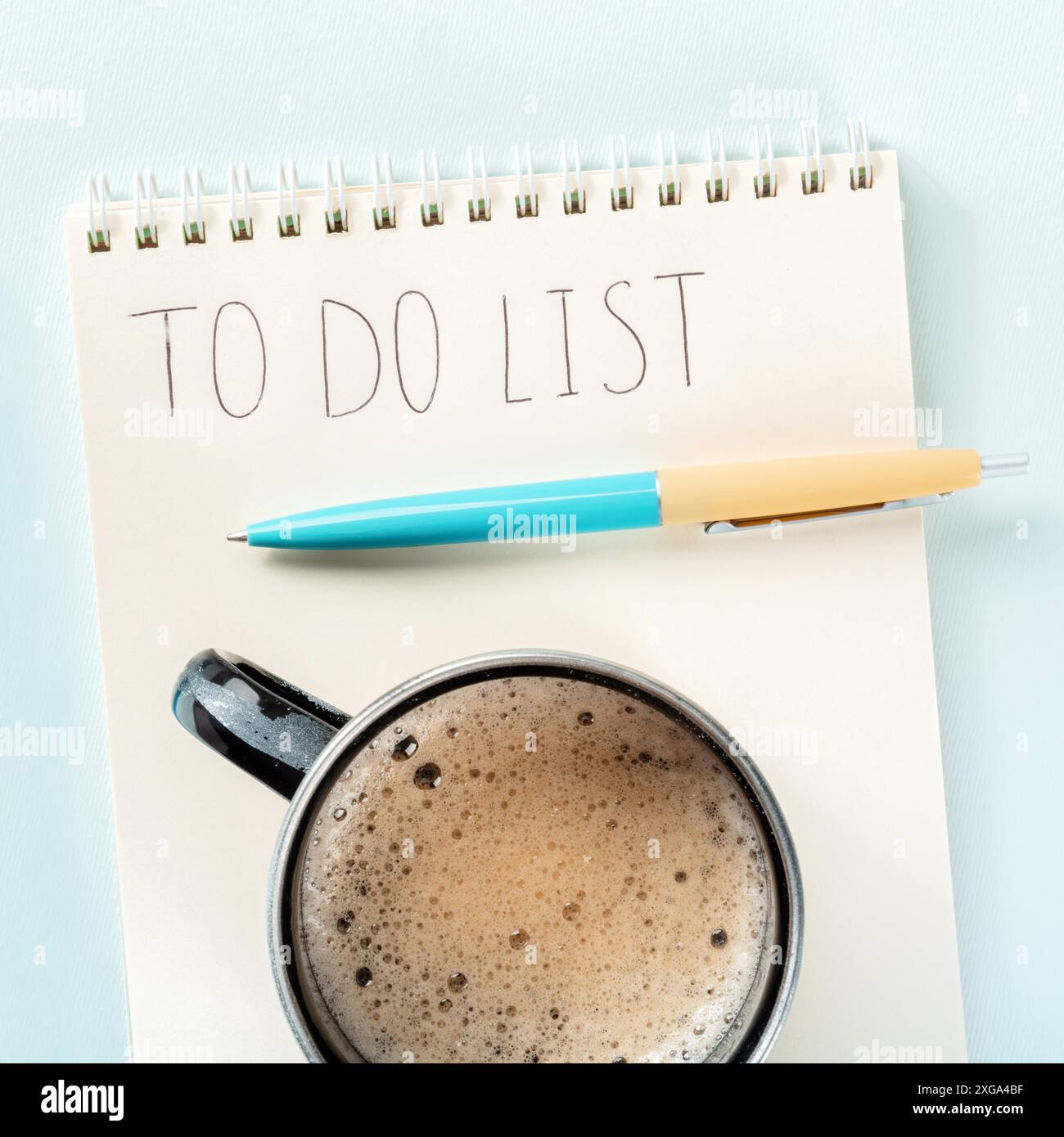 To do list square overhead shot. A paper notepad with a turquoise blue ...